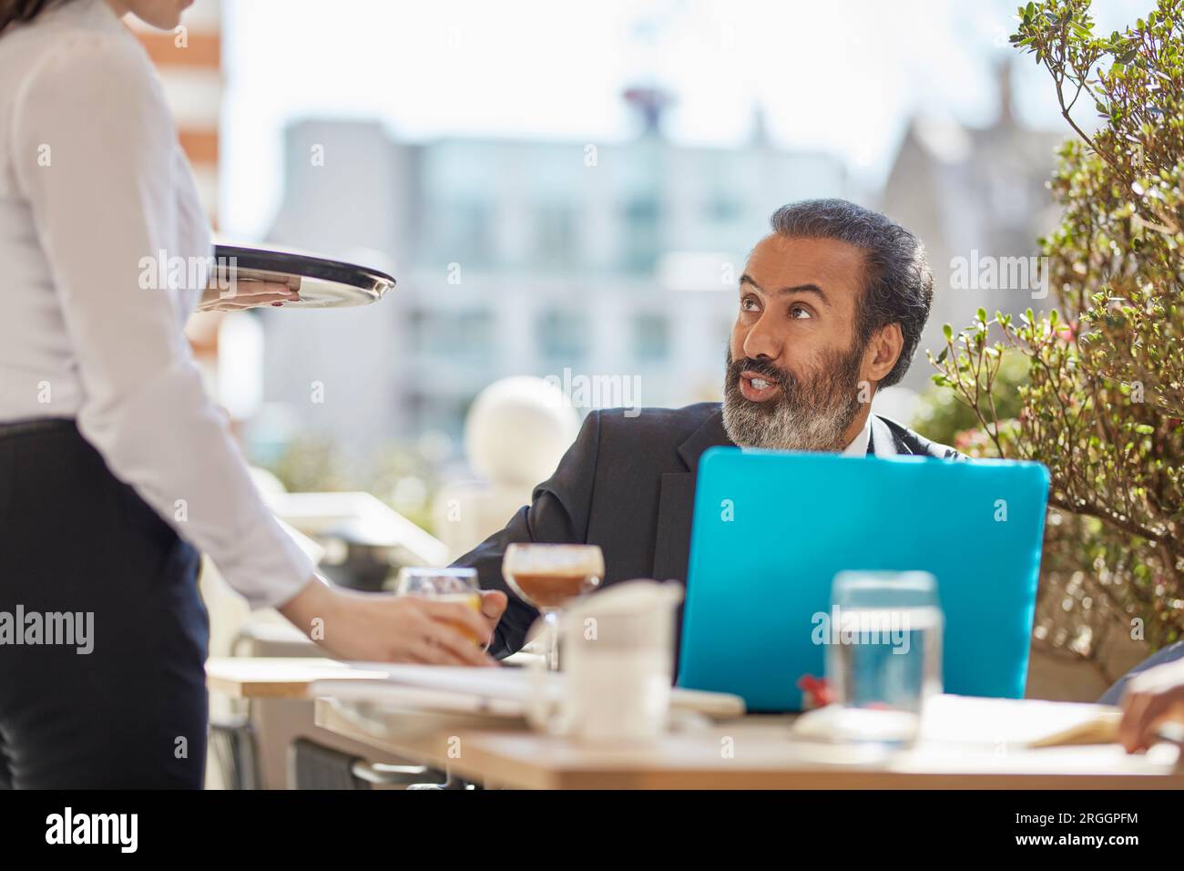 Male executive talking waitress cafe hi-res stock photography and ...