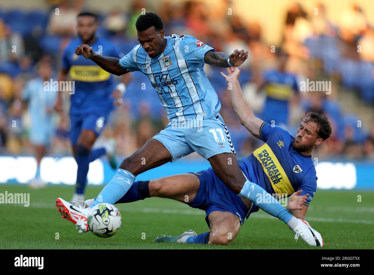 Coventry City's Haji Wright is fouled by AFC Wimbledon's Joe Lewis ...
