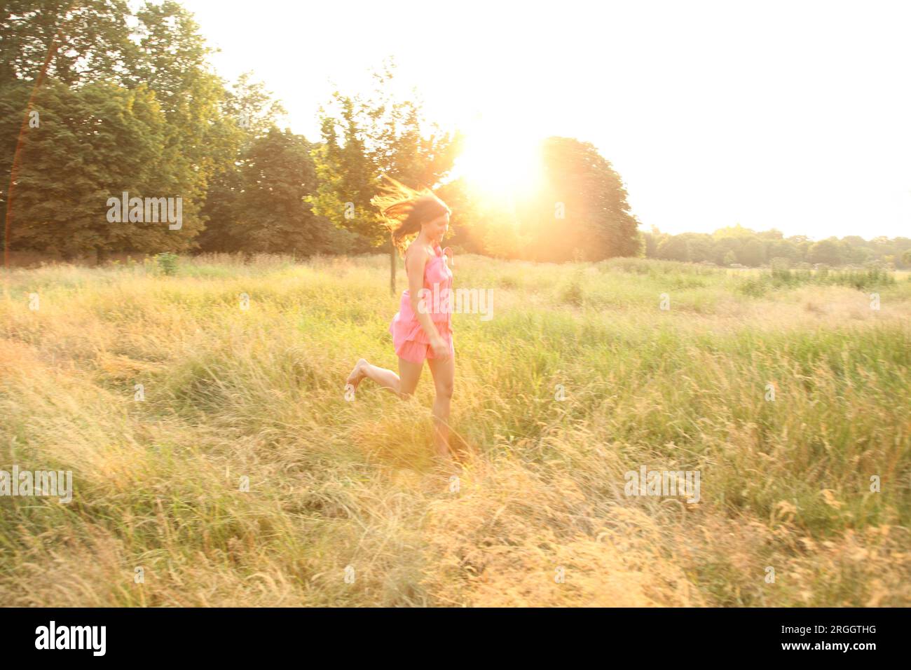 Woman in pink beautiful dress hi-res stock photography and images - Alamy