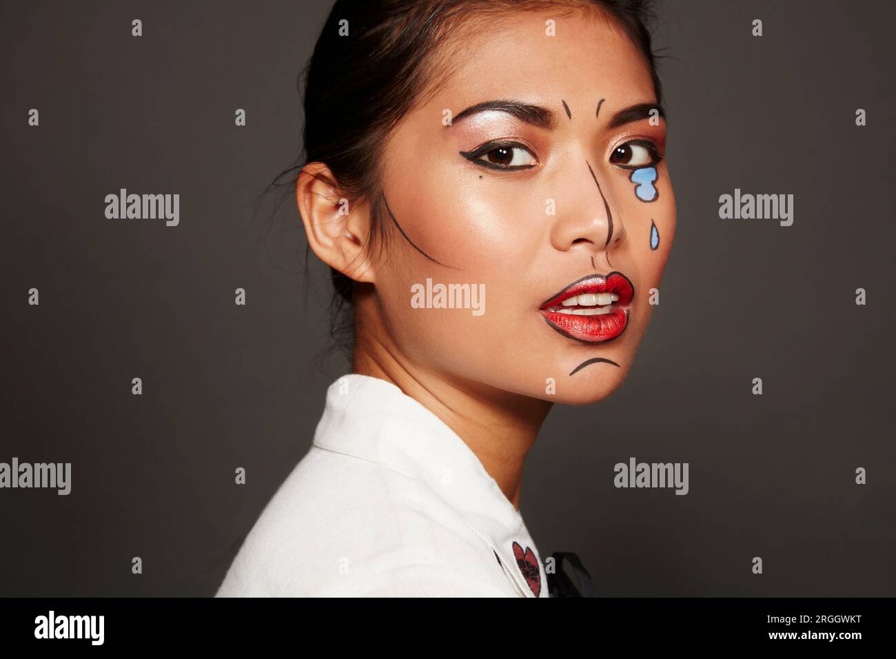Young woman with face paint tears and lines Stock Photo - Alamy
