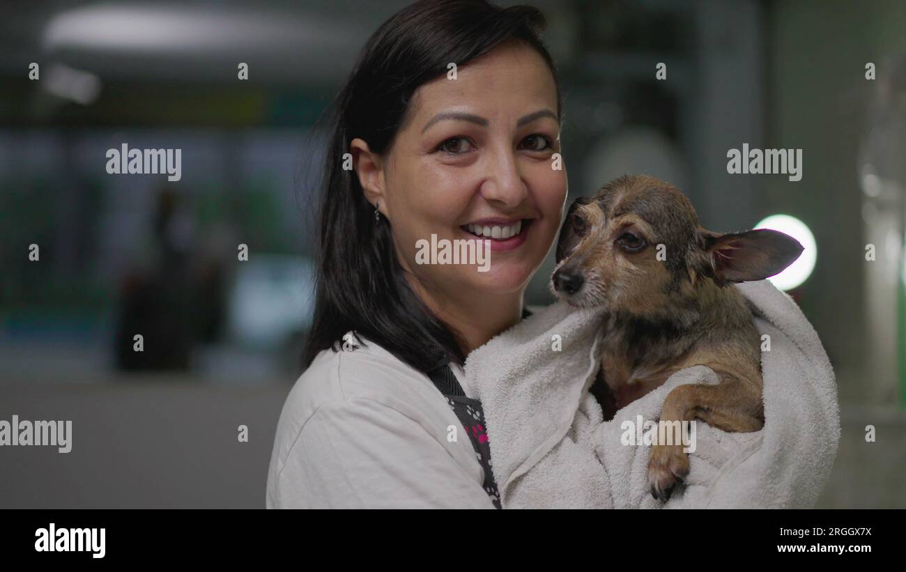 One happy female employee at Pet Shop. Close-up of a Person in ...