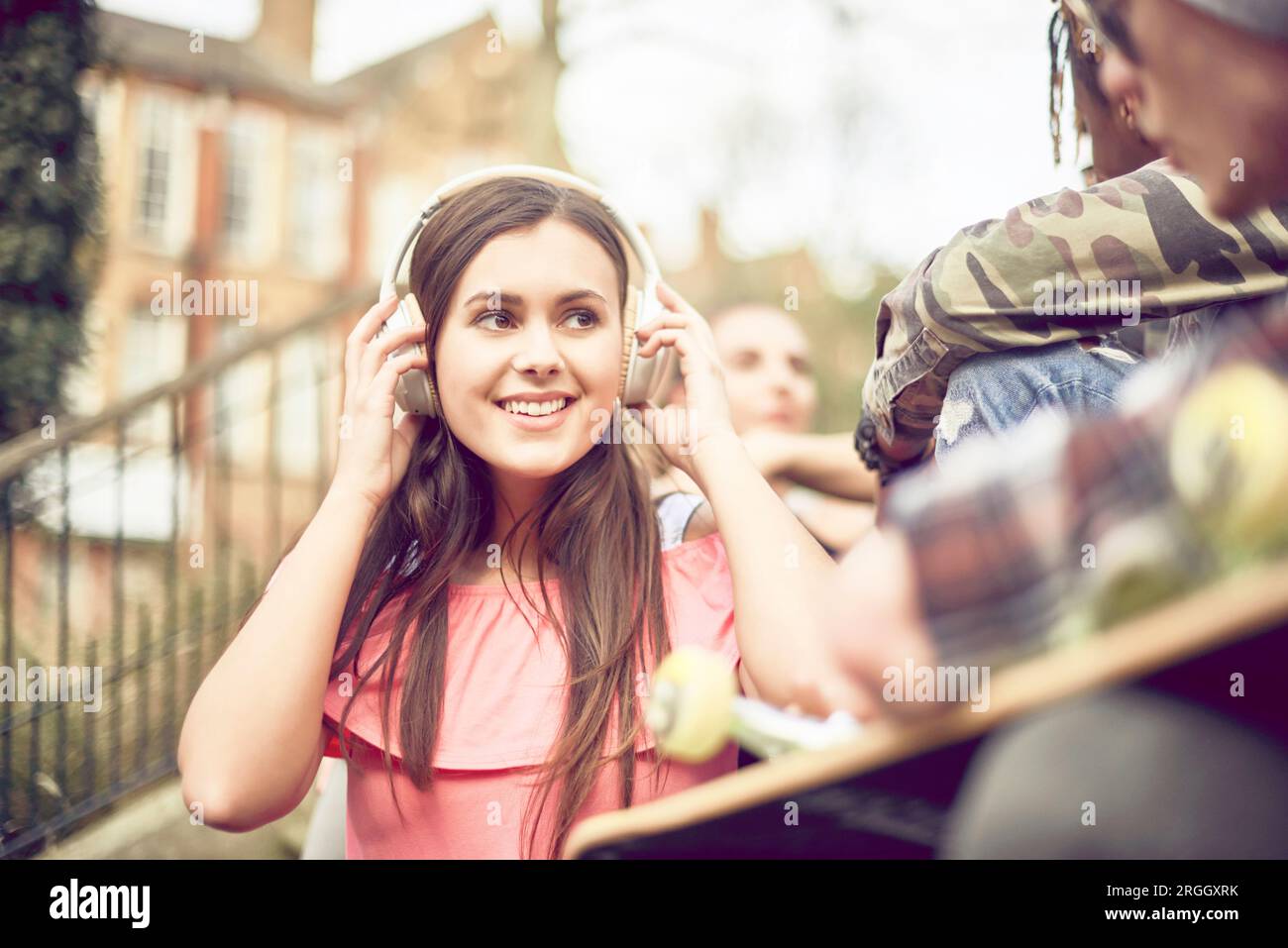 Teen friends listening music park hi-res stock photography and images ...