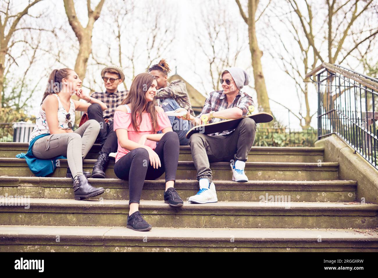 Boys girls sitting steps smiling hi-res stock photography and images ...