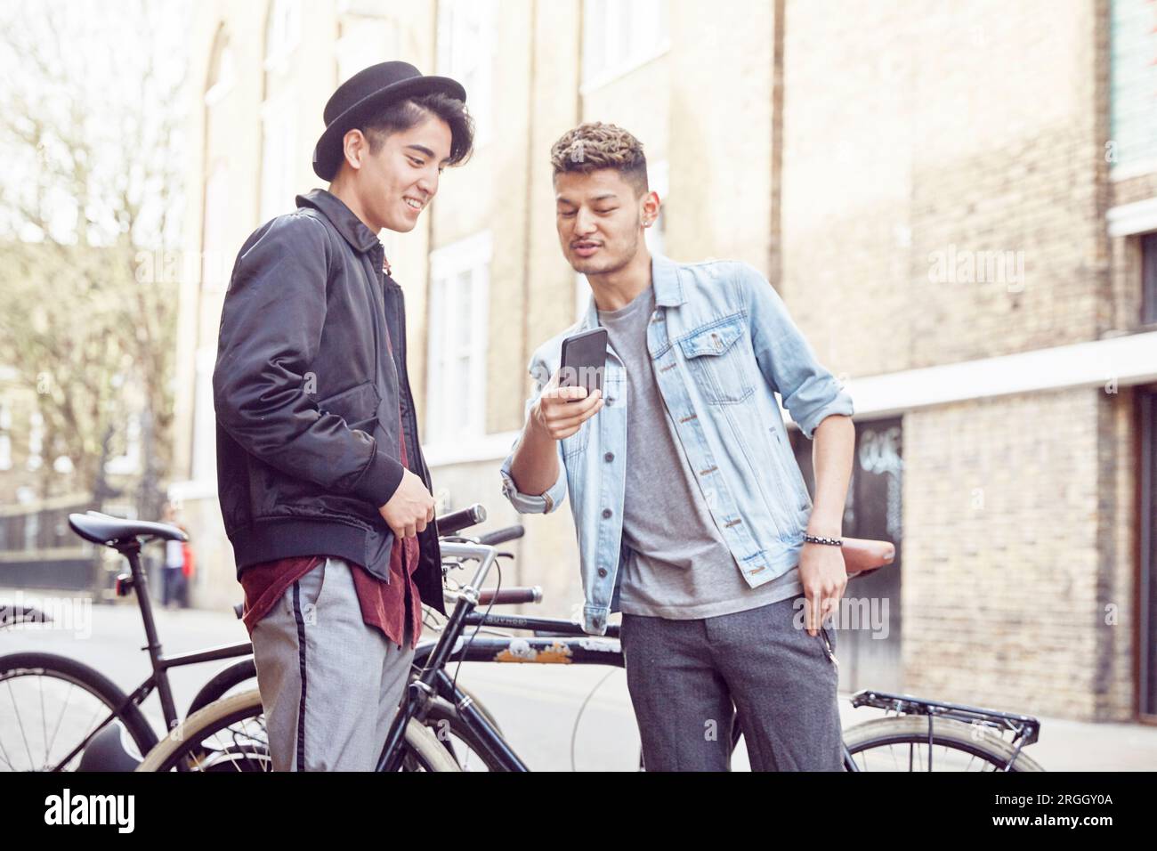 Two boys talking street hi-res stock photography and images - Alamy