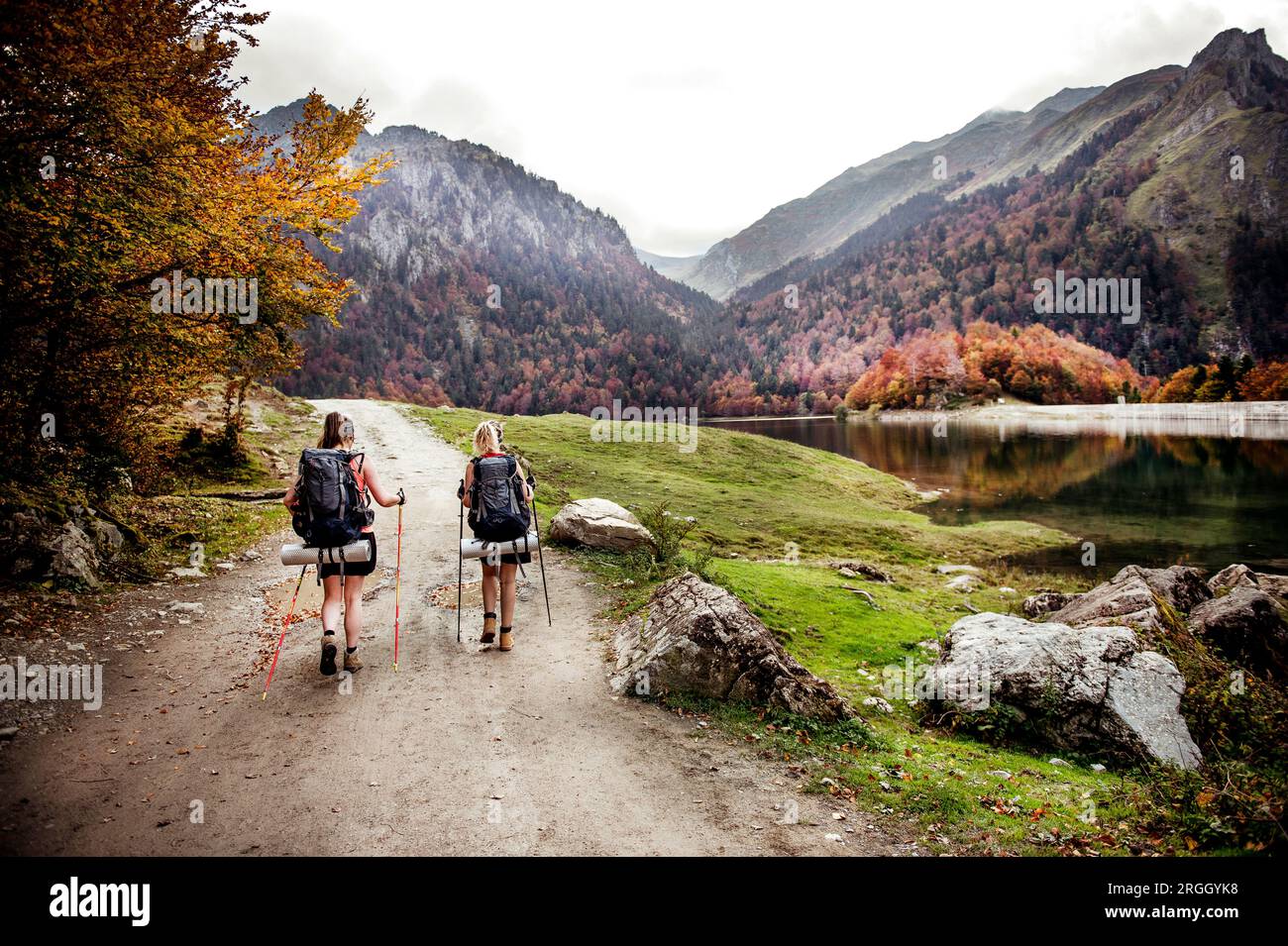 Young woman walking along lake hi-res stock photography and images - Alamy