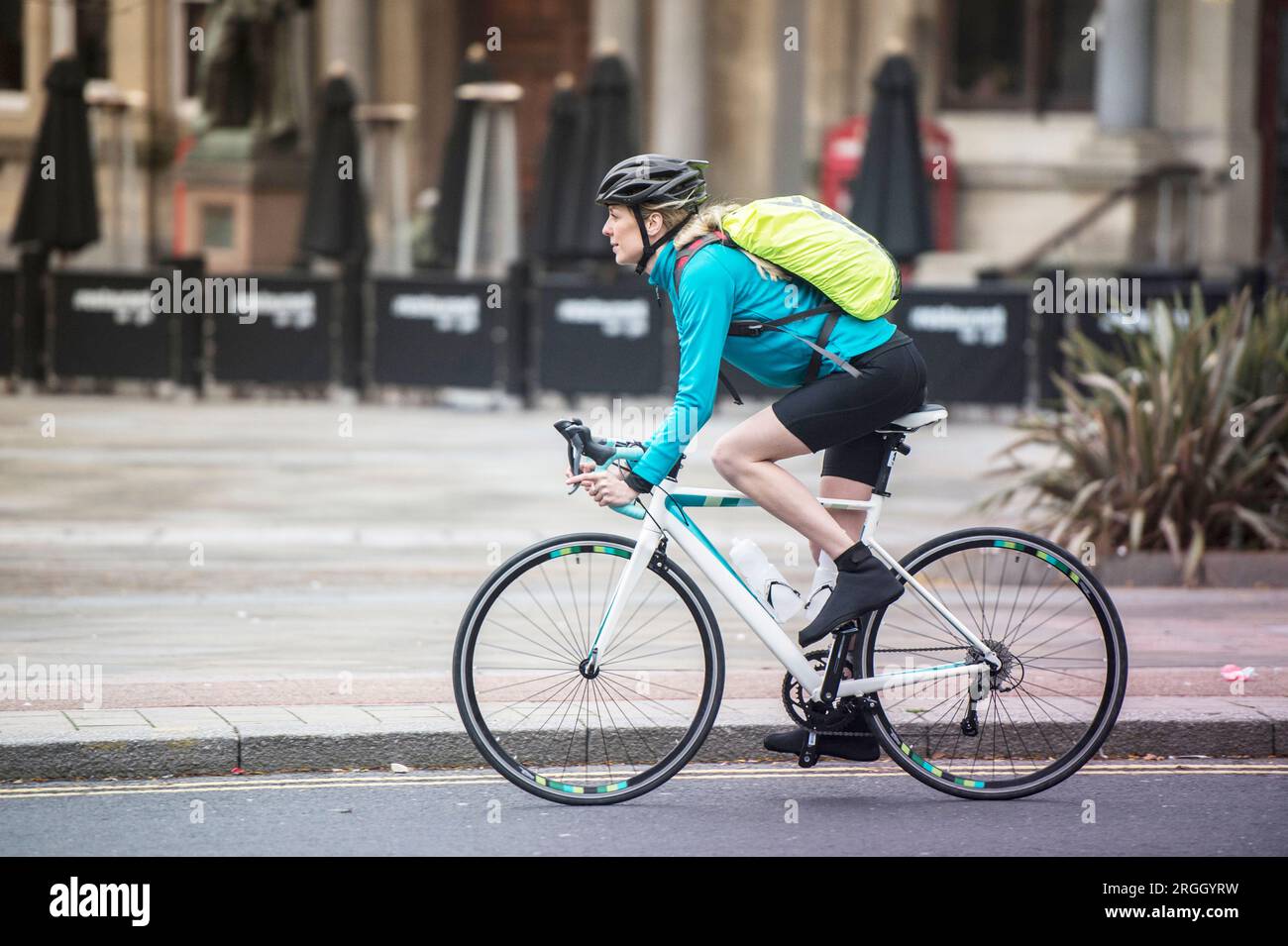 Woman commuting by bicycle hi-res stock photography and images - Alamy