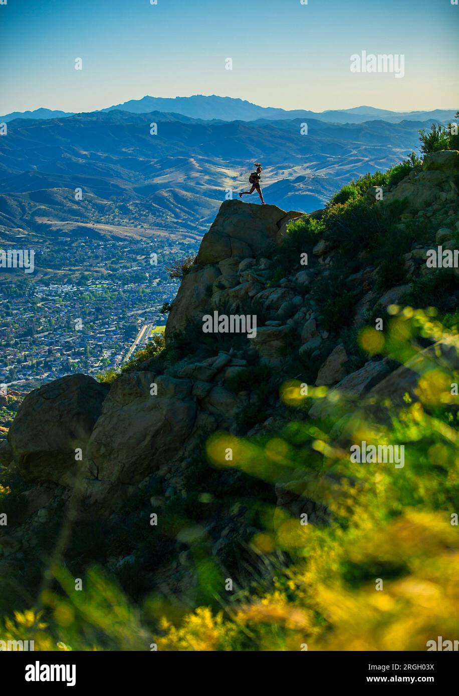 Adult running on rocks hi-res stock photography and images - Alamy
