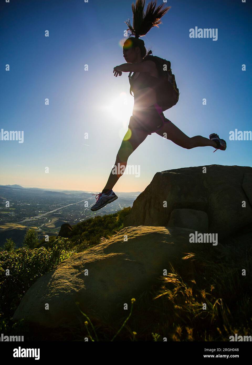 Adult running on rocks hi-res stock photography and images - Alamy