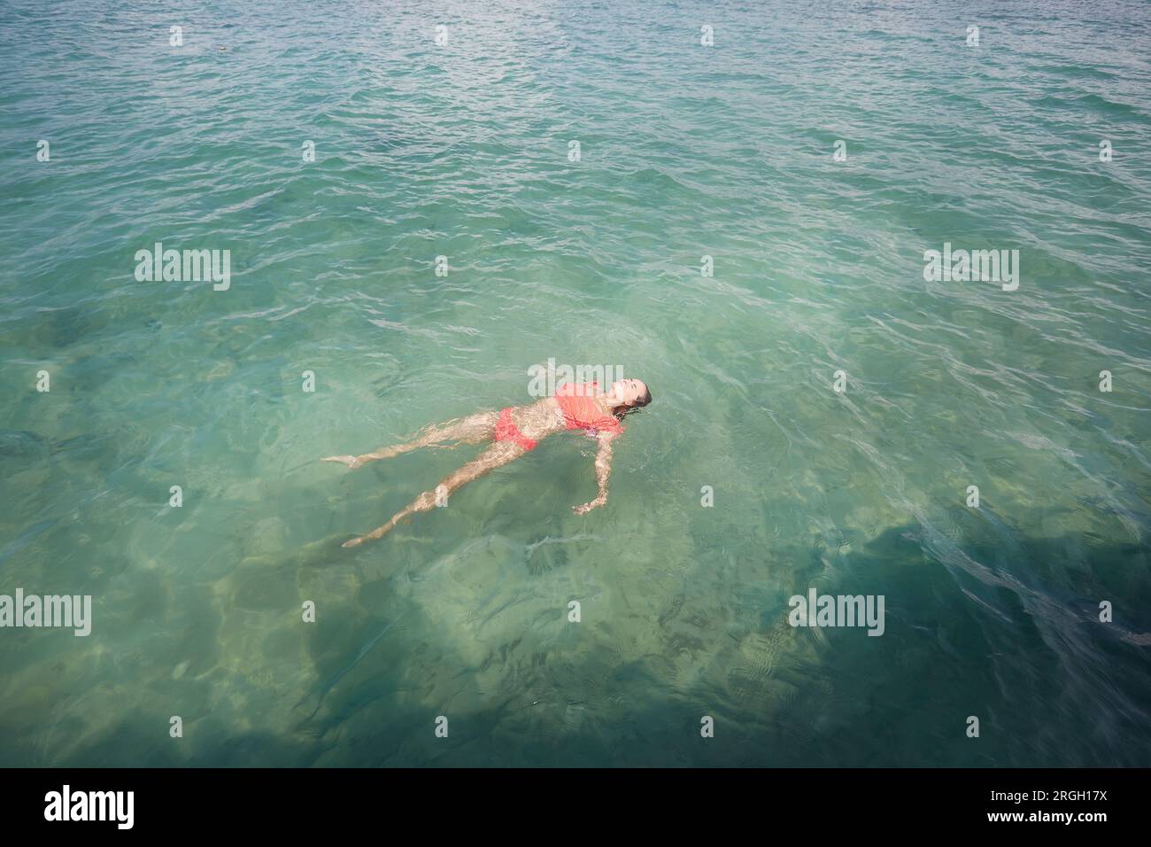 Woman swimming at sea hi-res stock photography and images - Alamy