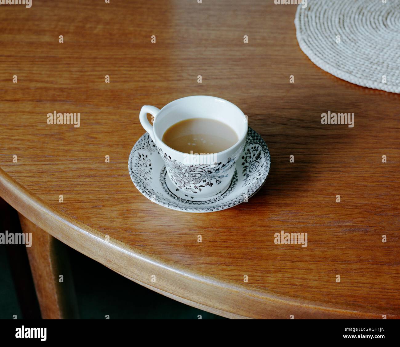 Tea cup and saucer on table Stock Photo - Alamy