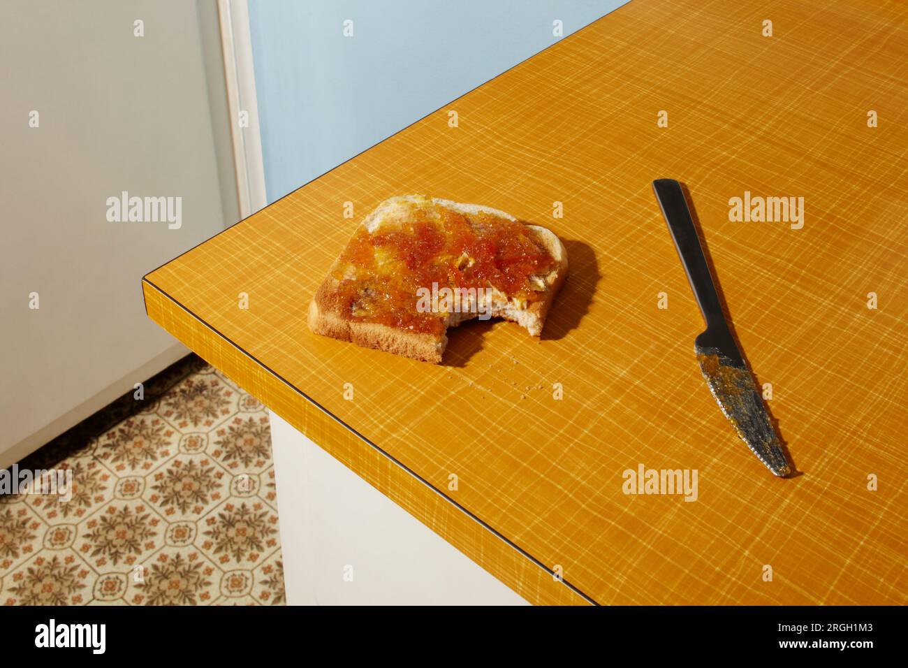 Toast with jam and missing bite Stock Photo - Alamy