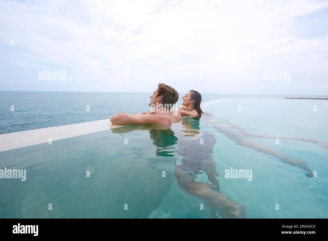 Young couple swimming hi-res stock photography and images - Alamy