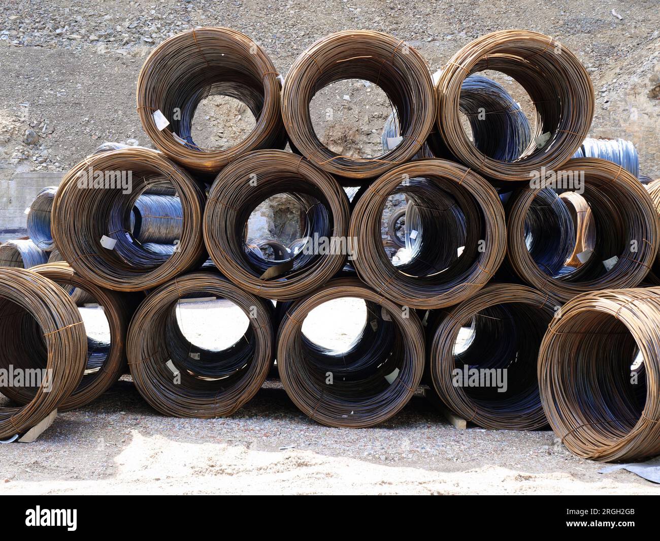 Coils of wire in a storage bin for processing Stock Photo - Alamy