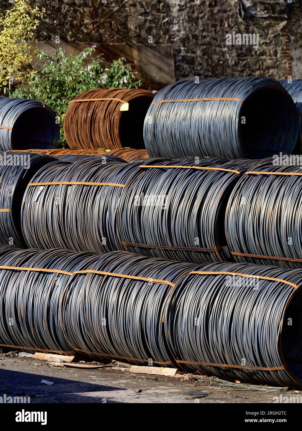 Coils of wire in a storage bin for processing Stock Photo - Alamy