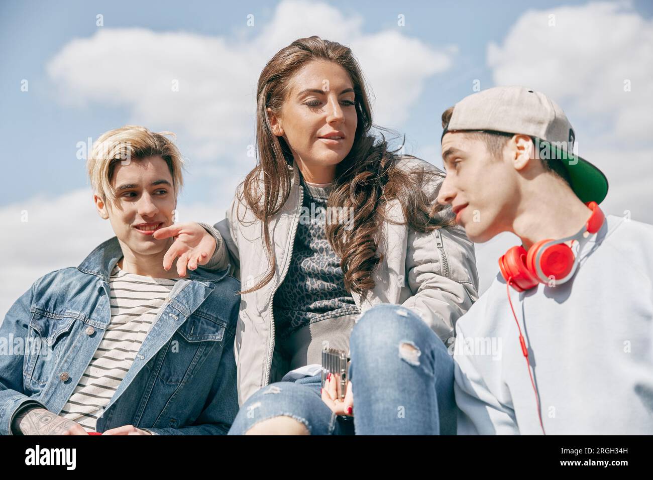 Teenage friends talking together Stock Photo - Alamy