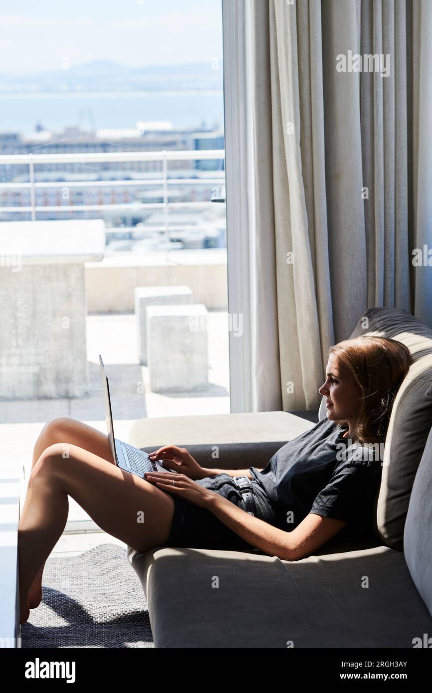 Woman relaxing with laptop hi-res stock photography and images - Alamy