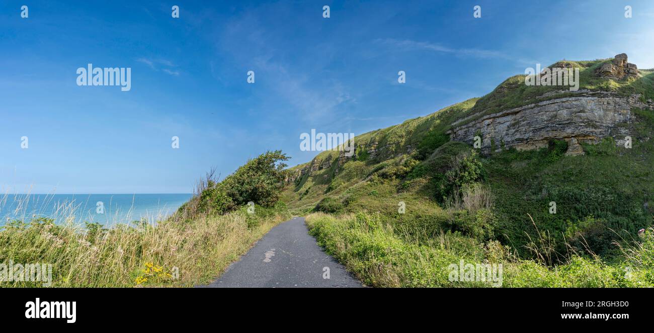 Battery of Longues-sur-Mer. View of the pebble beach surrounded by ...