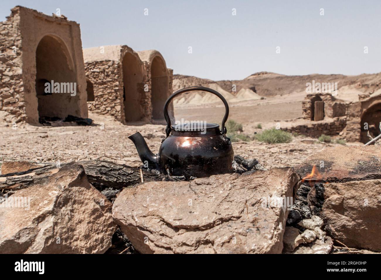 Tea kettle on campfire in Iranian desert Dasht-e Kavir near abandoned ...