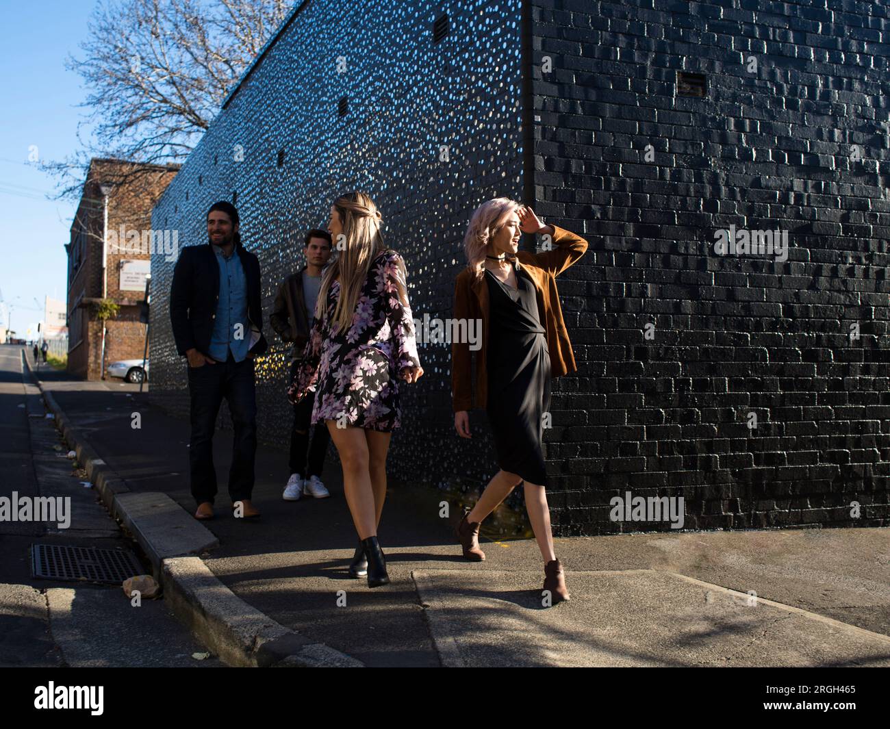 Group of friends walking on the street on the weekend hi-res stock ...