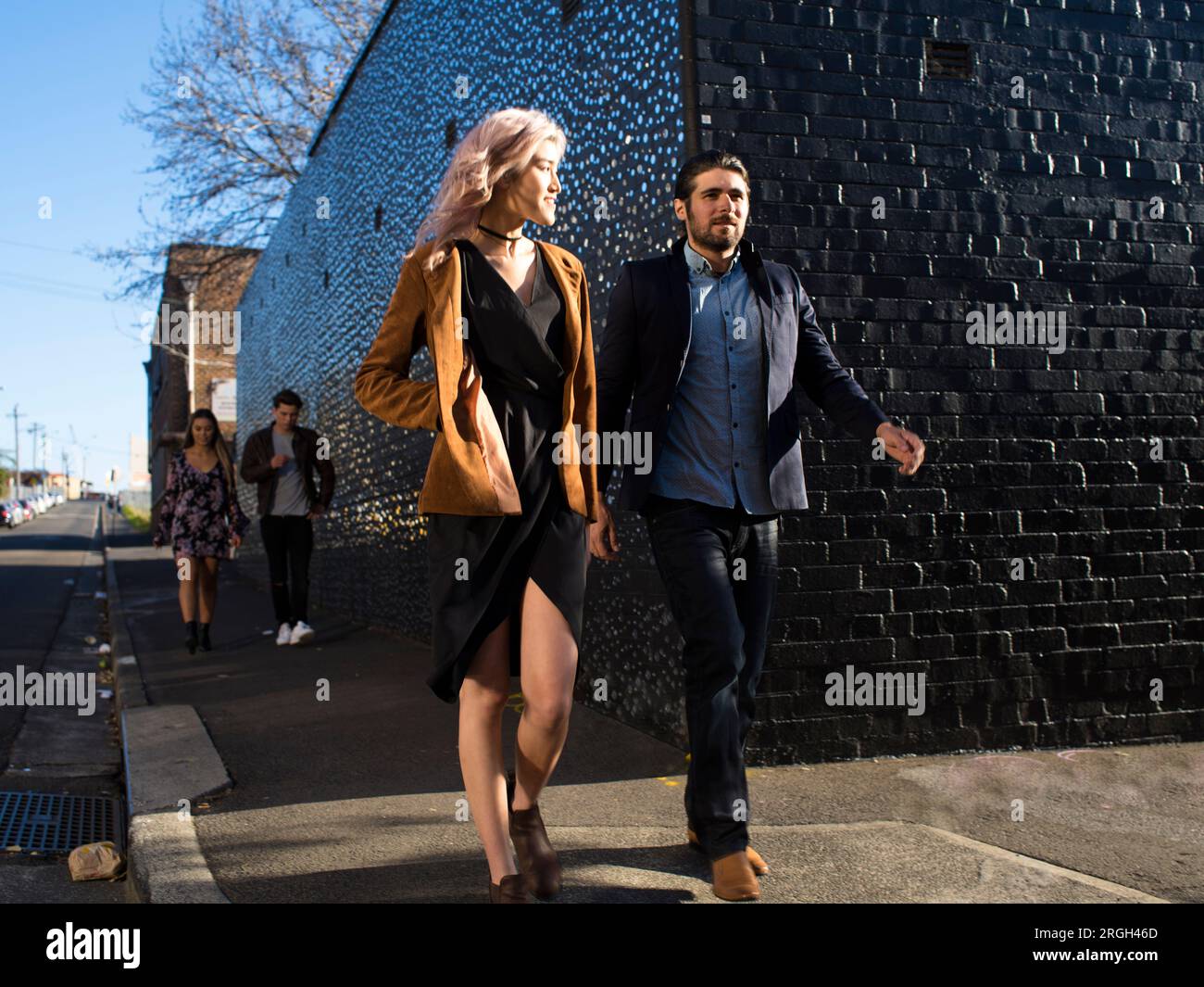 Man walking woman along pavement hi-res stock photography and images ...