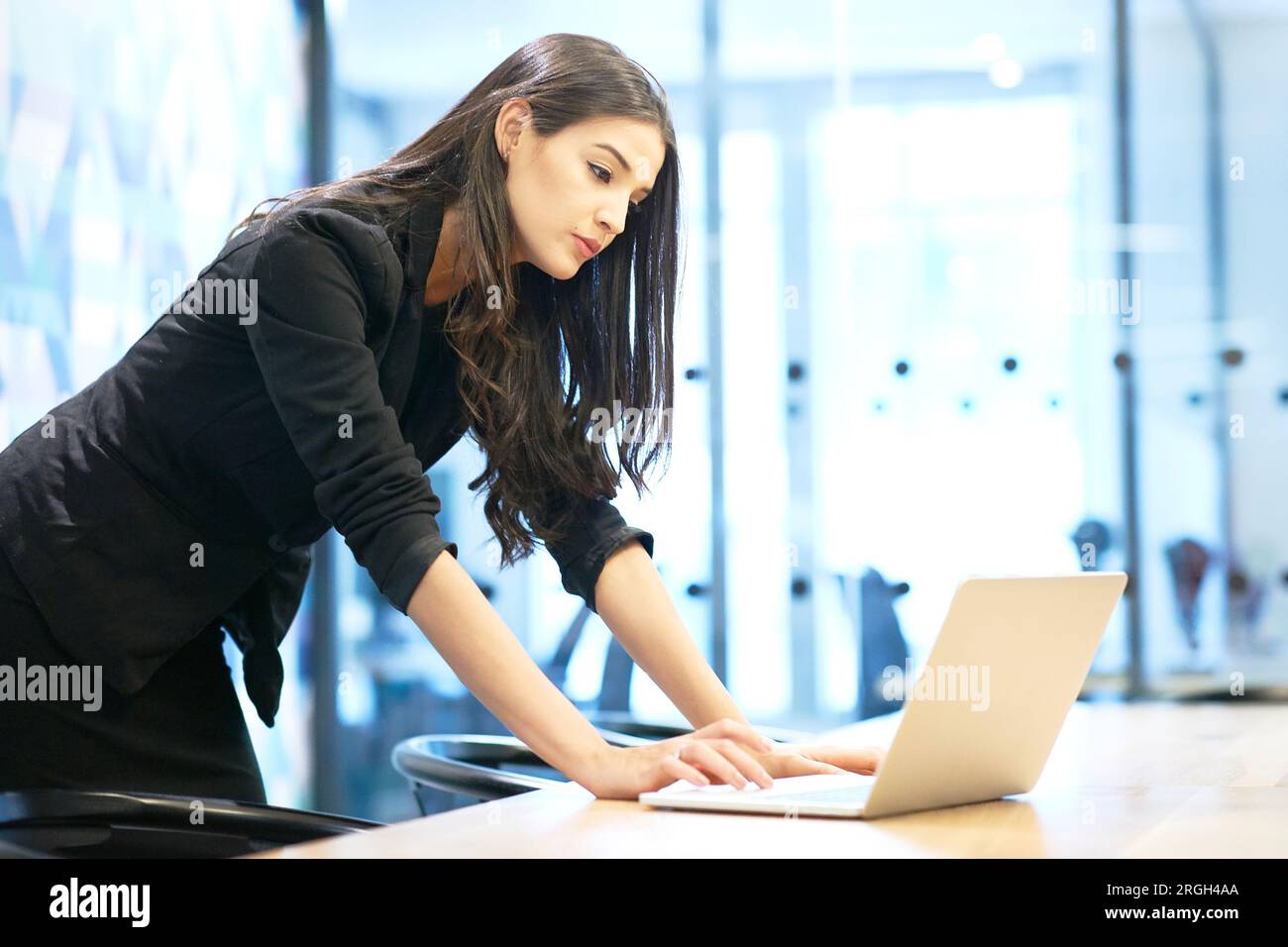 Woman bending over table hi-res stock photography and images - Alamy