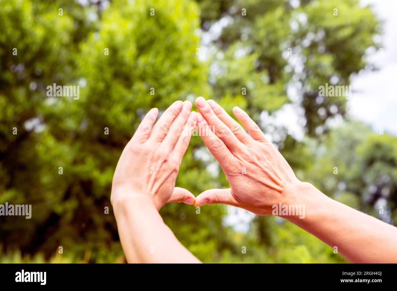 Hands forming triangle hi-res stock photography and images - Alamy