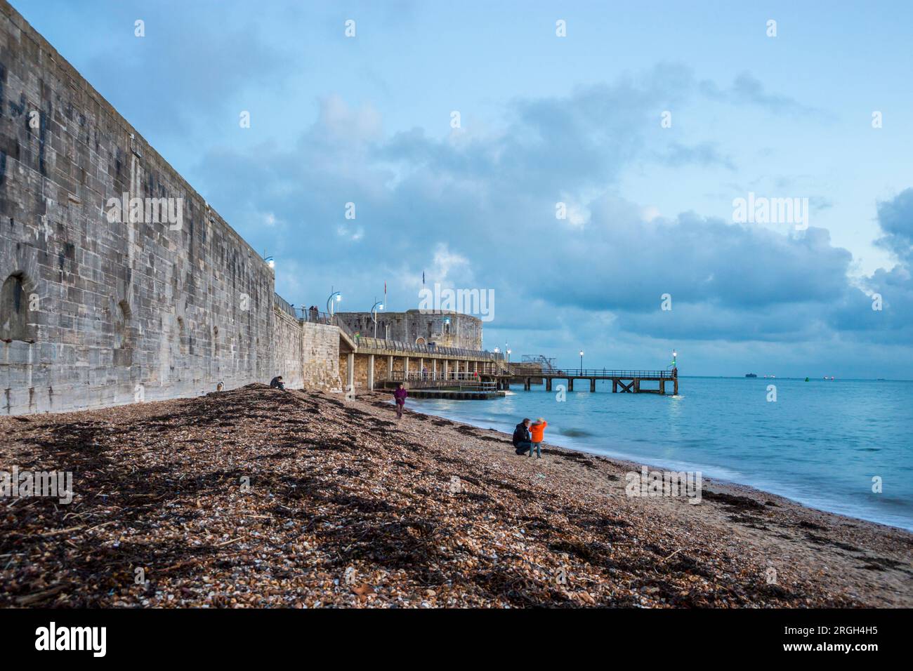 Stone wall by beach Stock Photo - Alamy