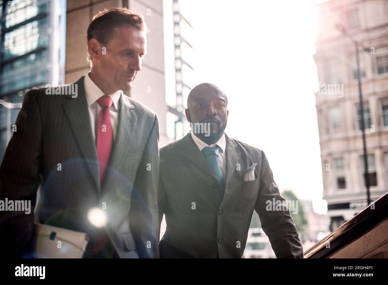 Two businessmen wearing suits hi-res stock photography and images - Alamy