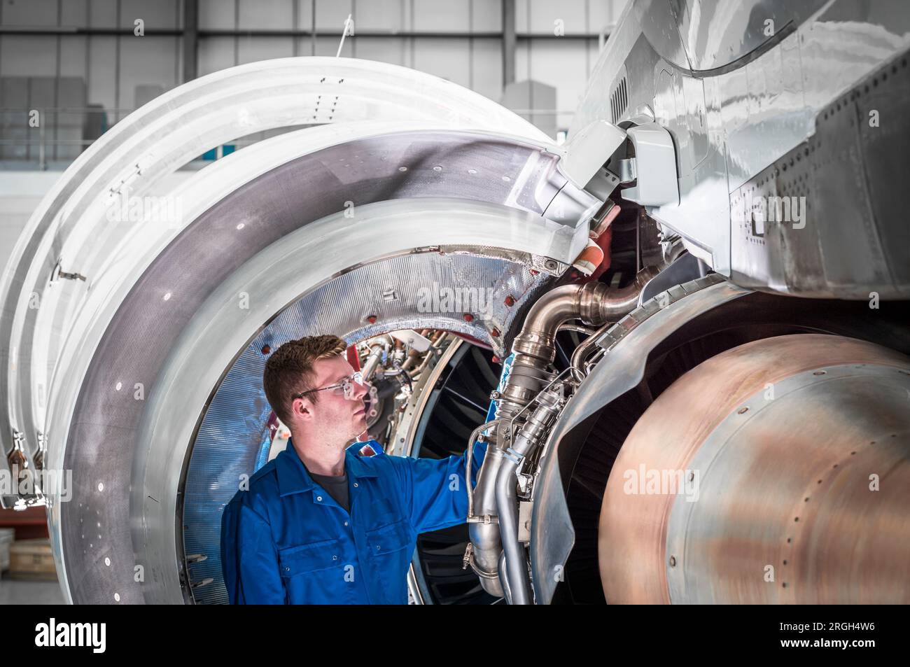 Man working on airplane engine Stock Photo - Alamy