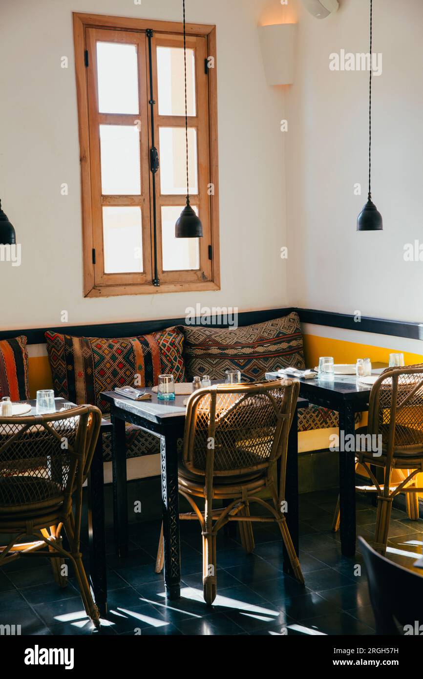 Cafe interior with patterned cushions Stock Photo - Alamy