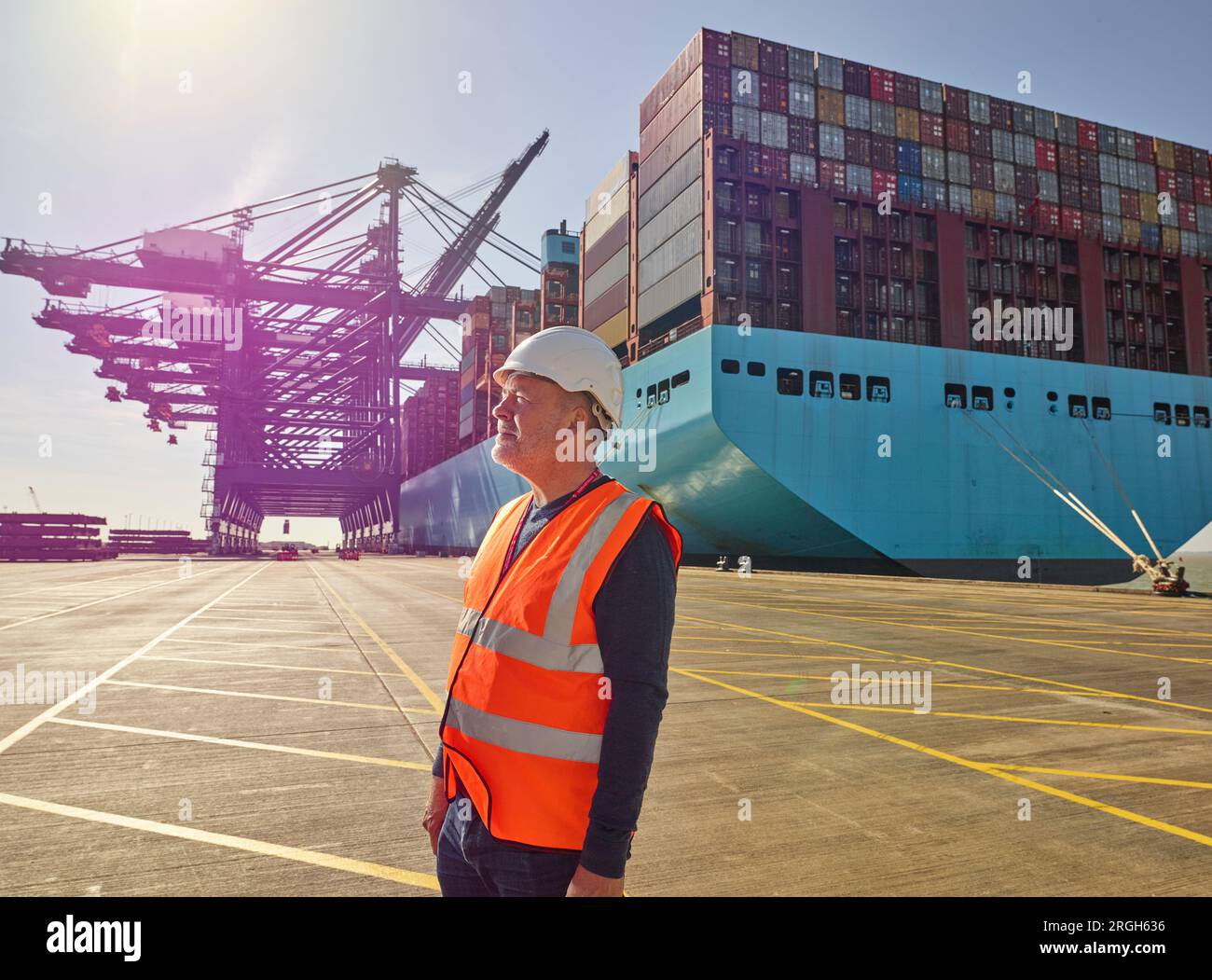 Dock worker by cargo ship at Port of Felixstowe, England Stock Photo ...