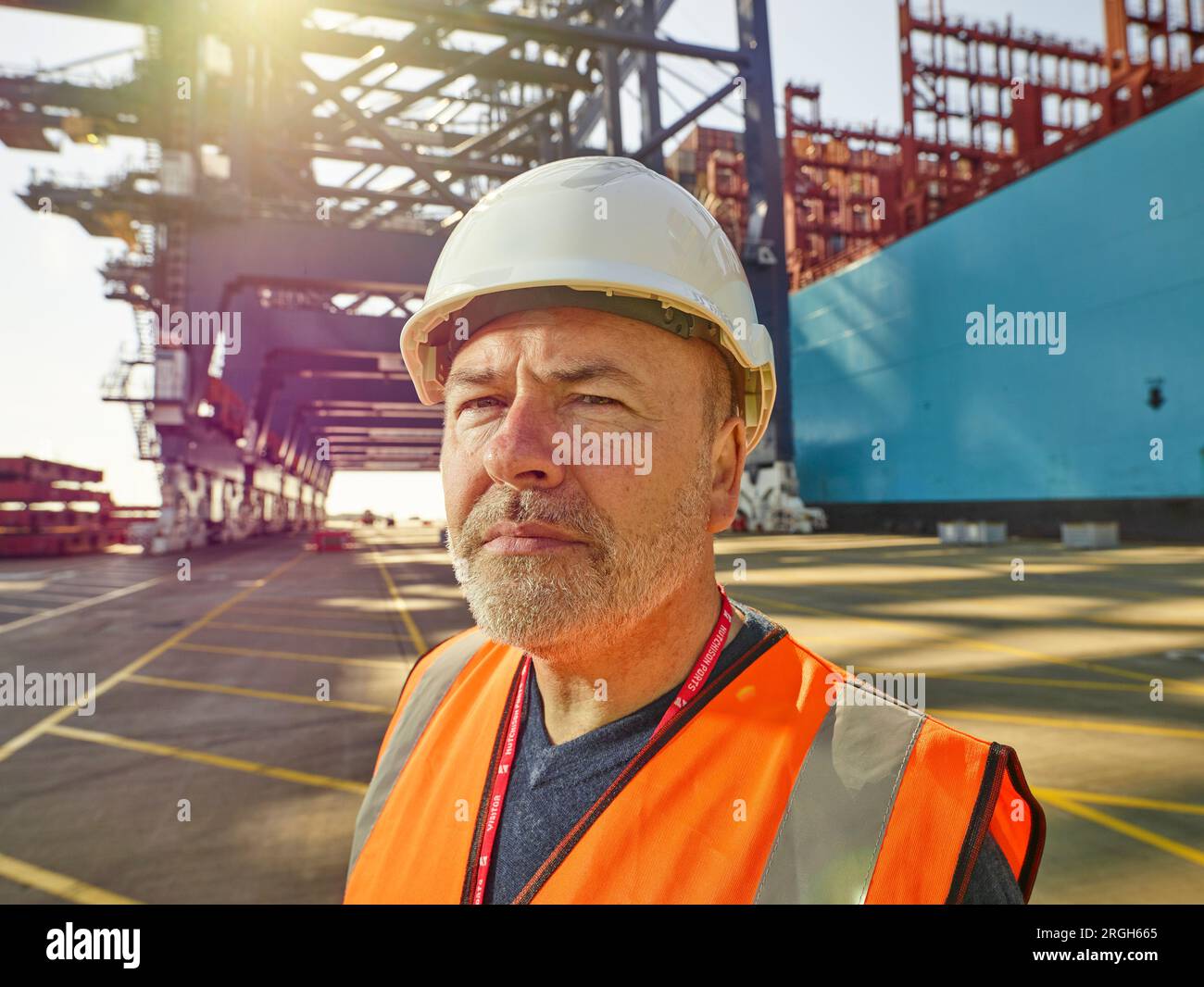 Dock worker by cargo ship at Port of Felixstowe, England Stock Photo ...