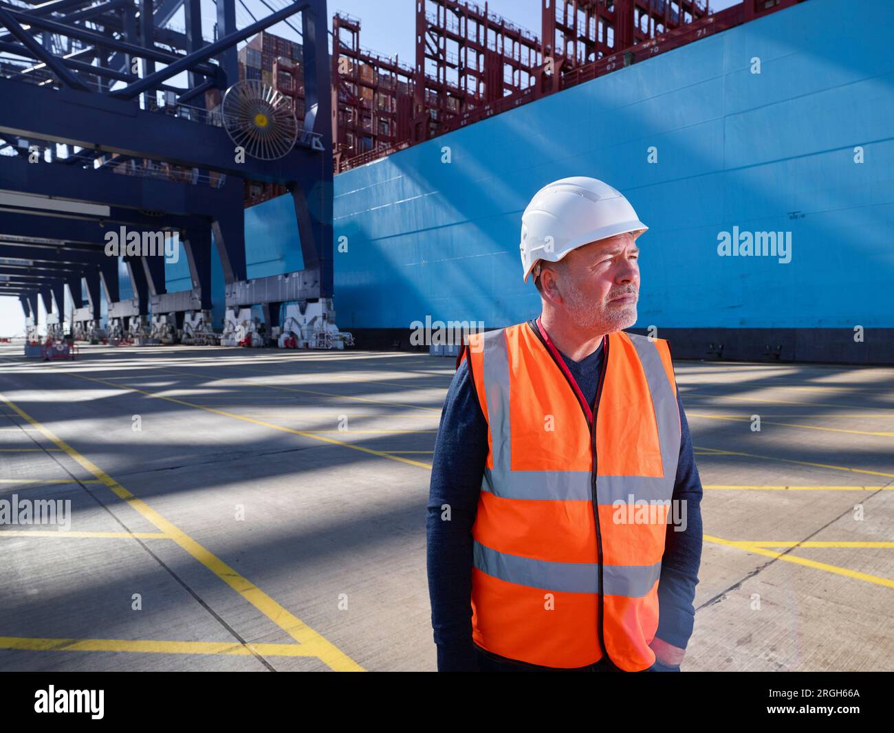 Dock worker by cargo ship at Port of Felixstowe, England Stock Photo ...