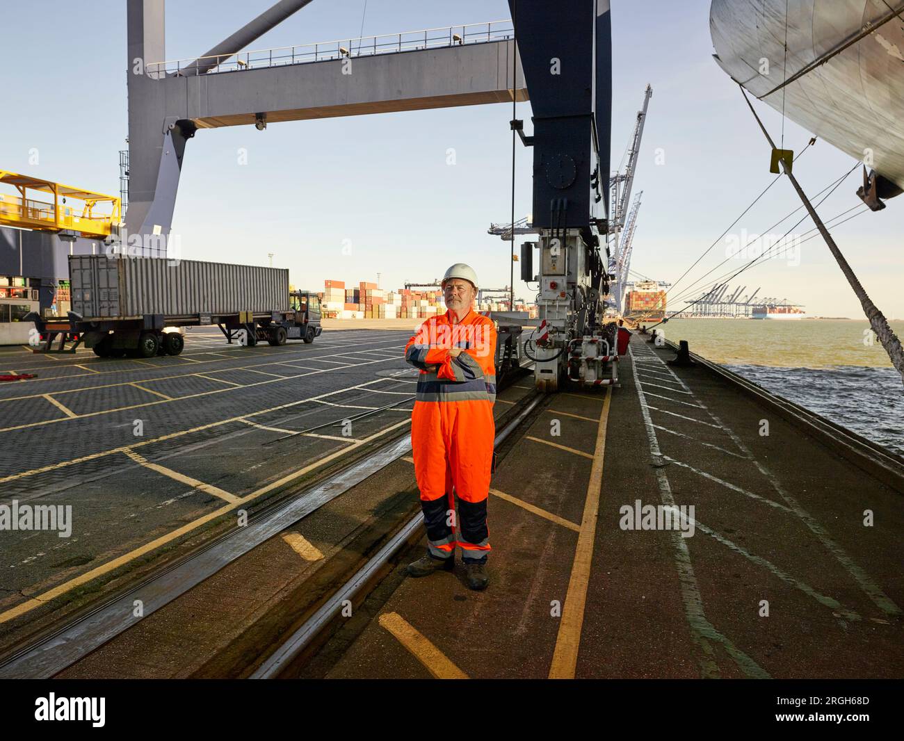 Dock worker in orange jumpsuit at Port of Felixstowe, England Stock ...