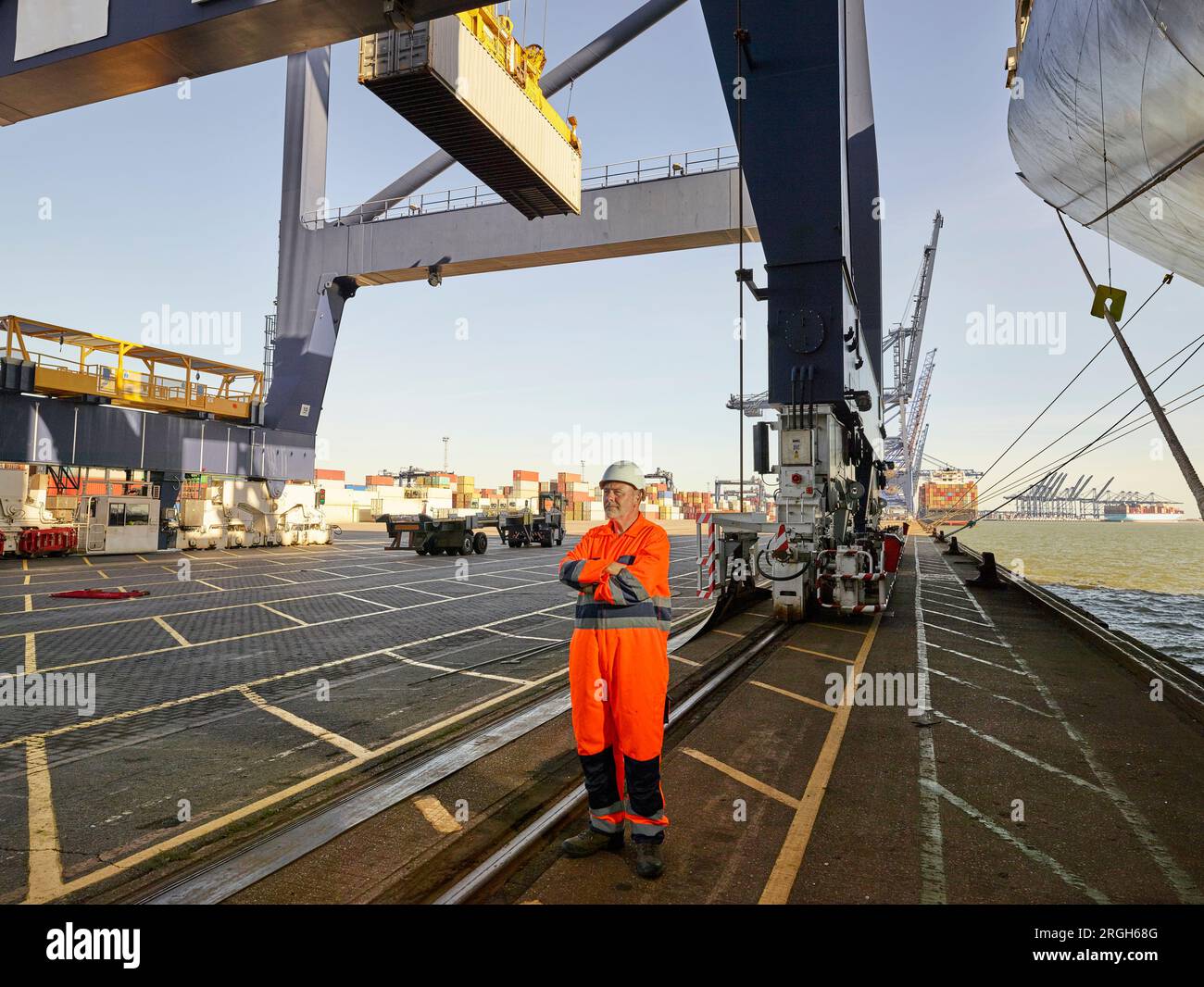 Dock worker in orange jumpsuit at Port of Felixstowe, England Stock ...