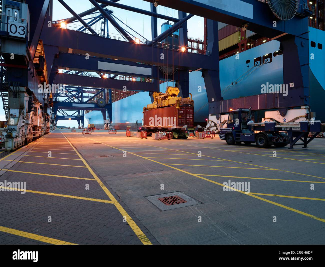 Cranes unloading cargo containers at Port of Felixstowe, England Stock ...