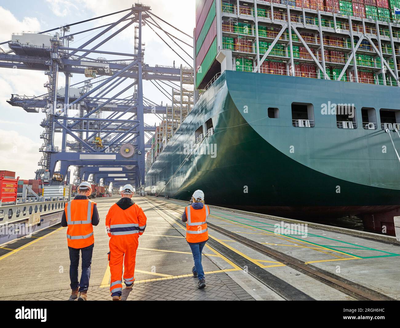 Dock workers by cargo ship at Port of Felixstowe, England Stock Photo - Alamy