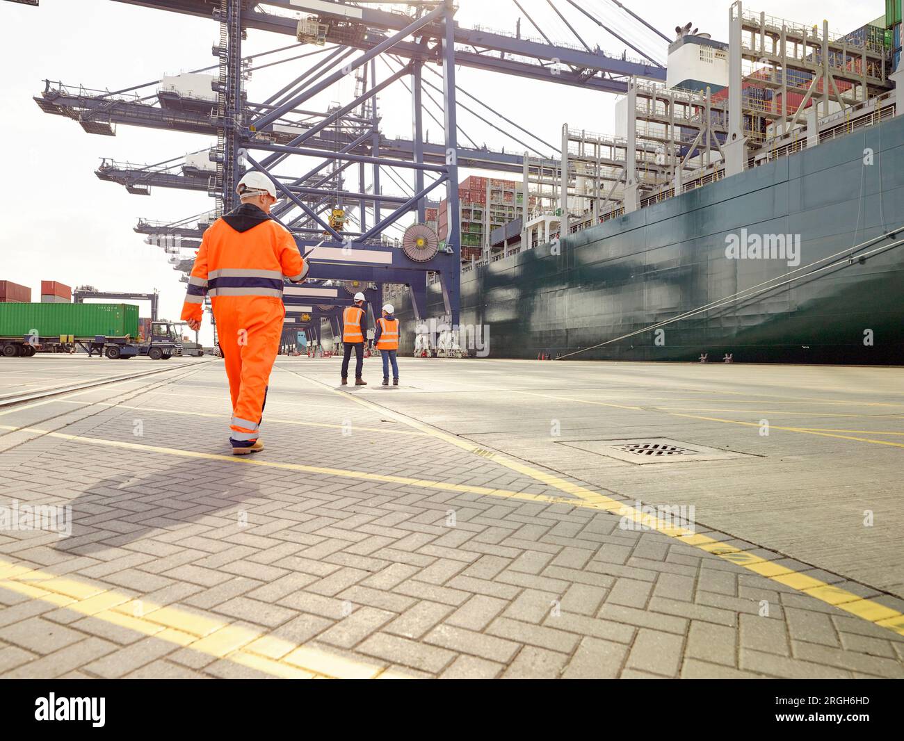 Dock workers beside cargo ship at Port of Felixstowe, England Stock ...
