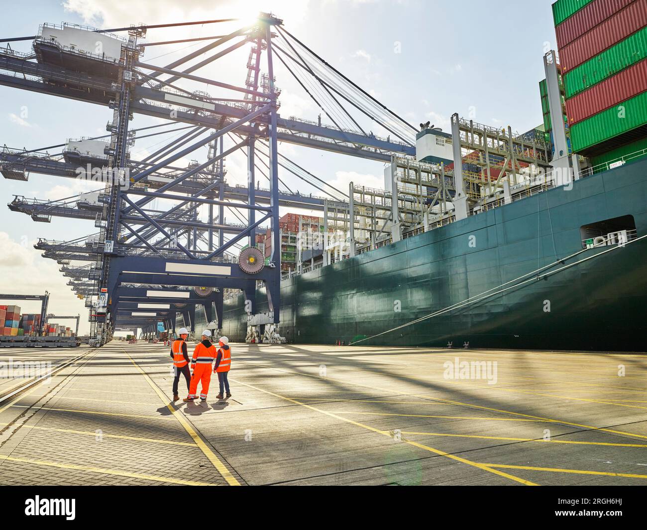 Dock workers beside cargo ship at Port of Felixstowe, England Stock ...
