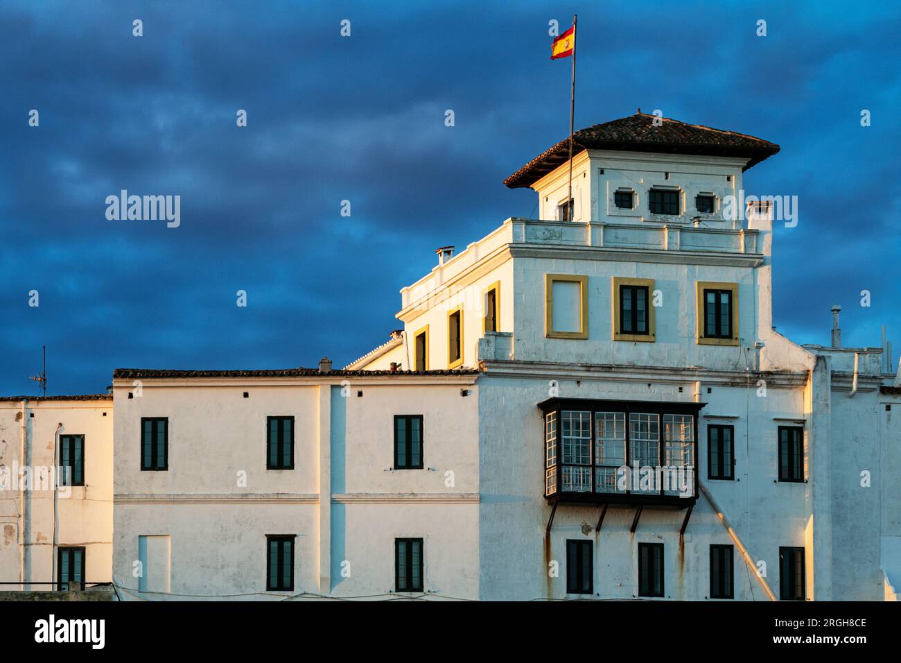 Spanish flag flies from a government building in Porto Mahon Stock ...