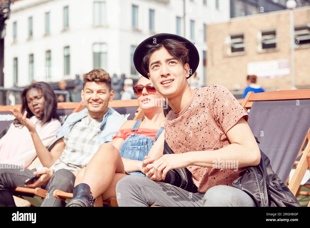 Friends group sun loungers hi-res stock photography and images - Alamy