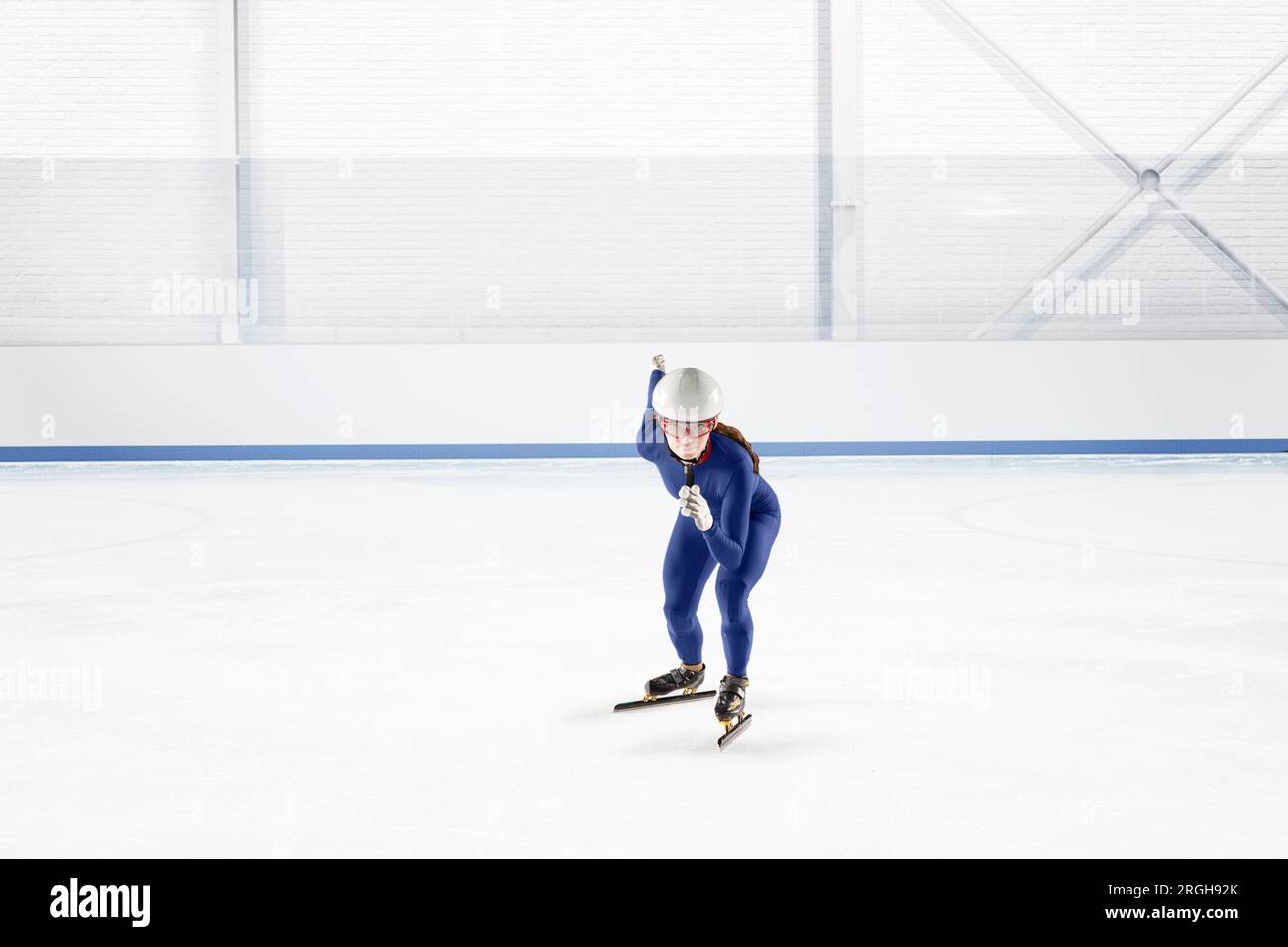 Young woman practicing speed skating at ice rink Stock Photo - Alamy
