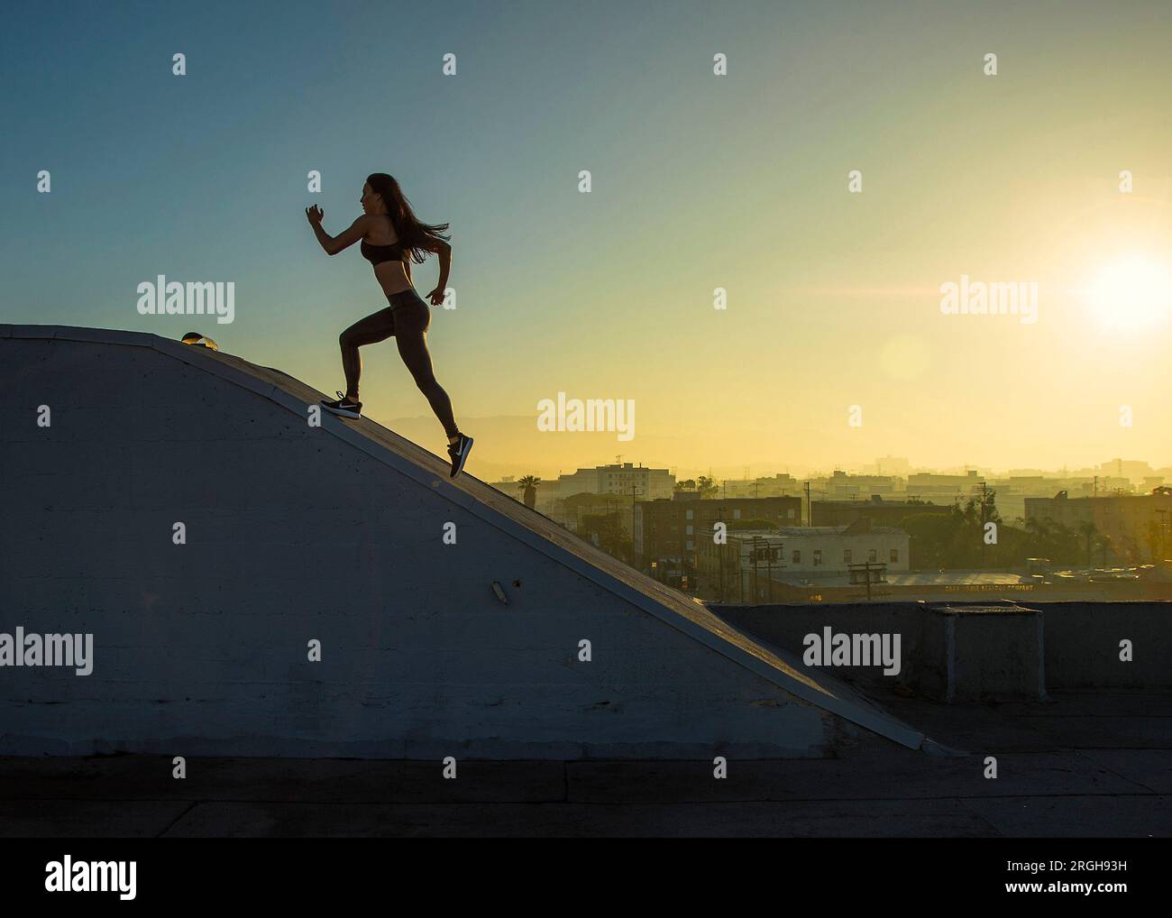 Woman jogging dusk in urban hi-res stock photography and images - Alamy