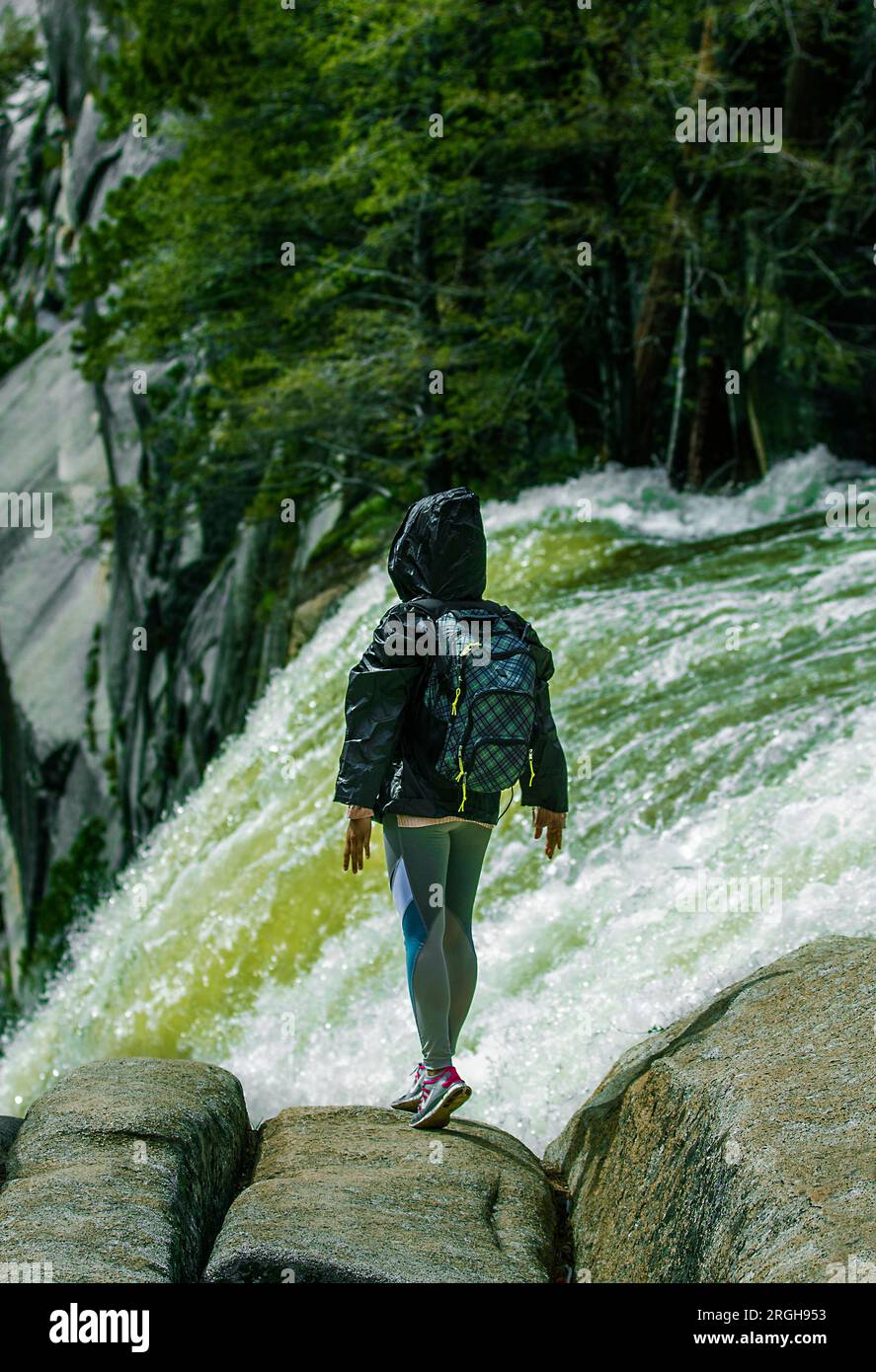 Person standing waterfall hi-res stock photography and images - Alamy