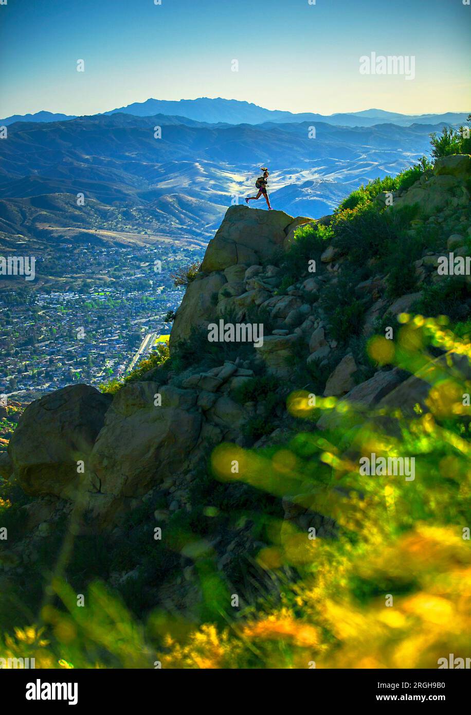 Adult running on rocks hi-res stock photography and images - Alamy
