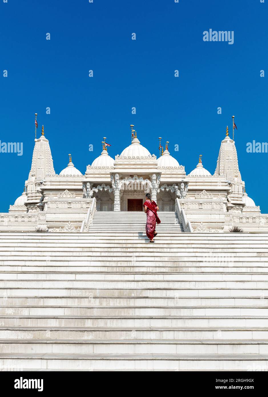 Hindu woman acends steps of the Mandir, Atlanta, Georgia, USA Stock ...