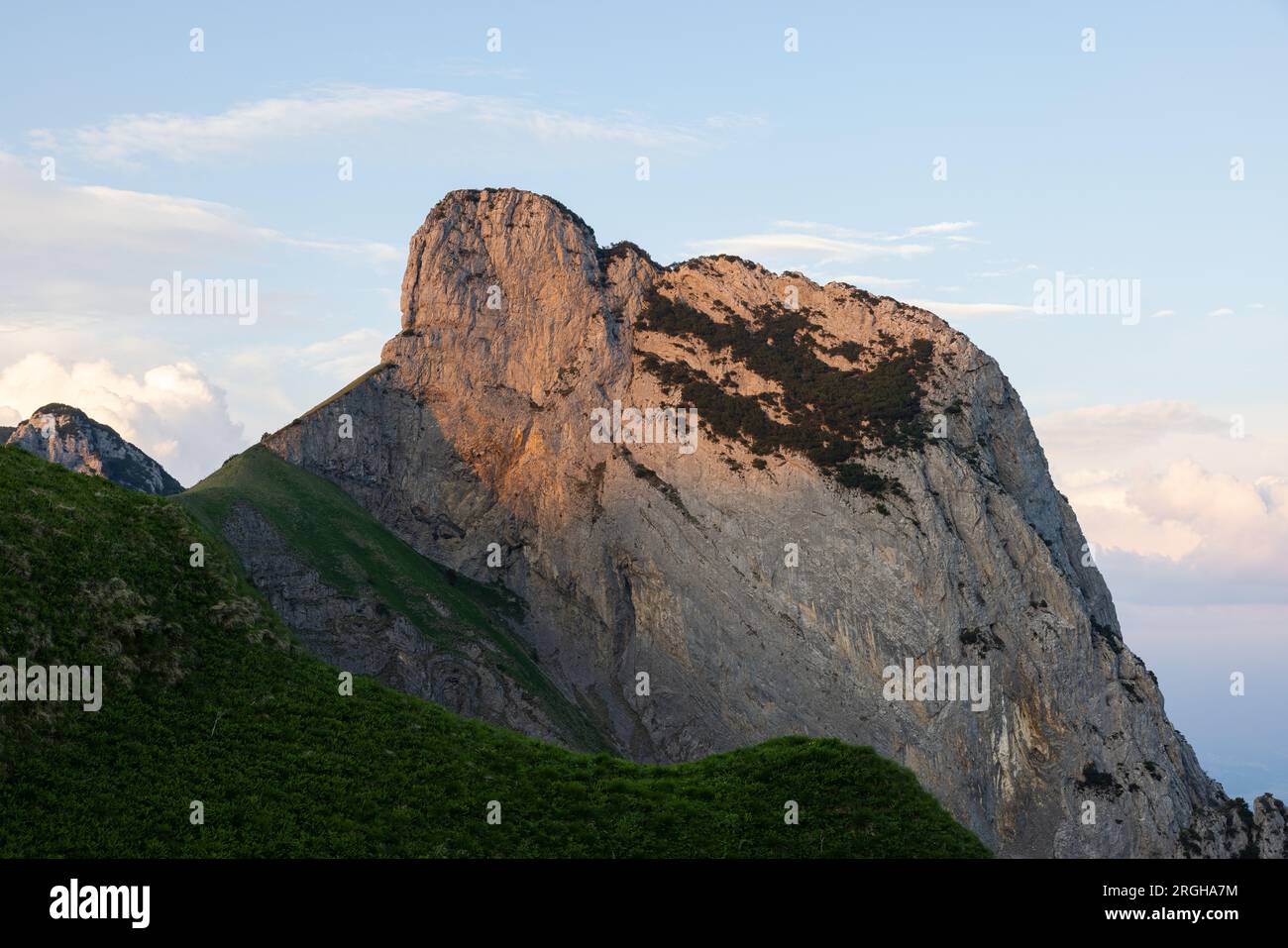 The Saxer Gap in the Swiss Alps is lit up by the sun on a morning Stock ...