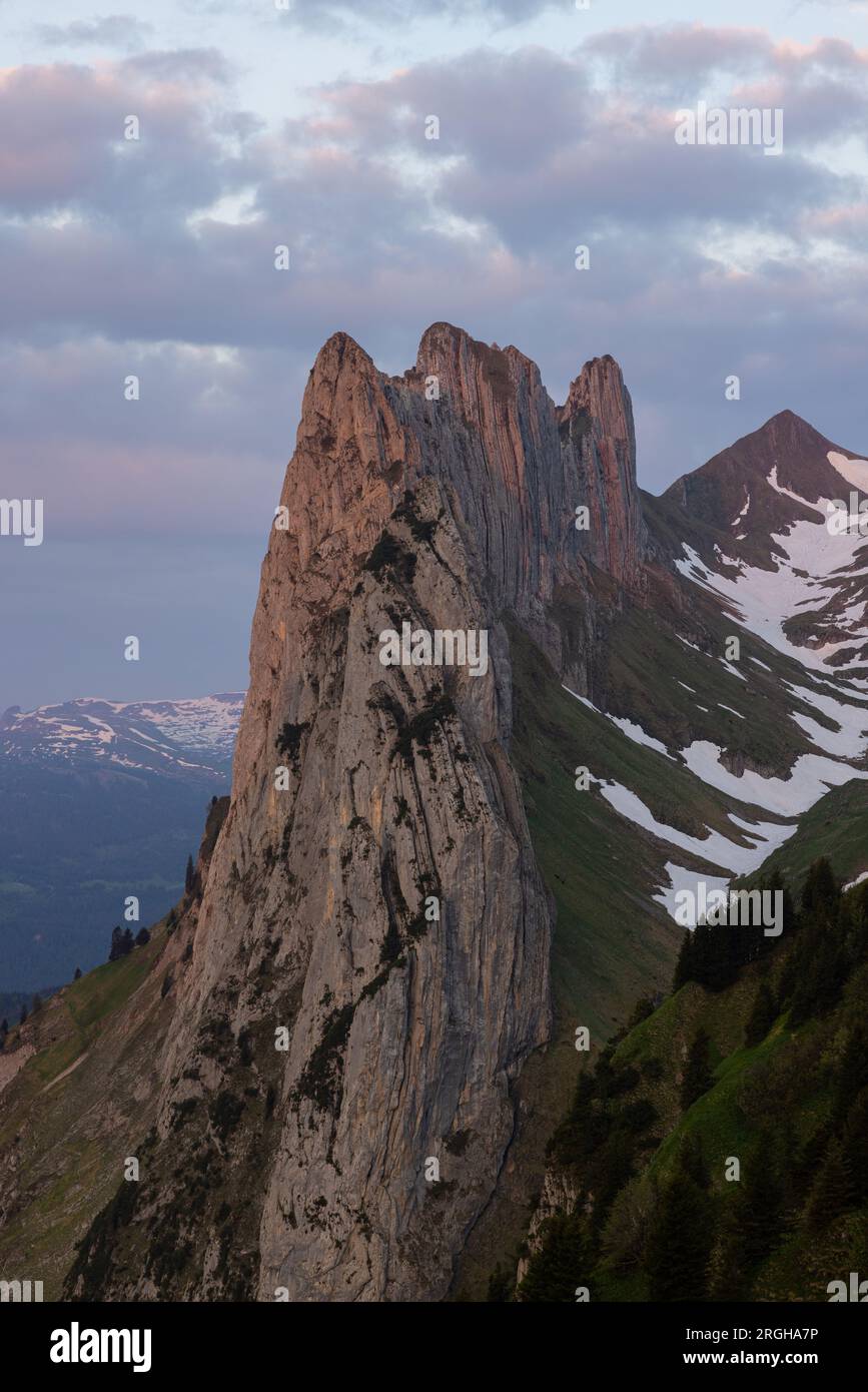 The Saxer Gap in the Swiss Alps is lit up by the sun on a morning Stock ...
