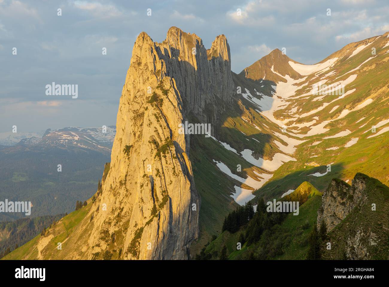 The Saxer Gap in the Swiss Alps is lit up by the sun on a morning Stock ...