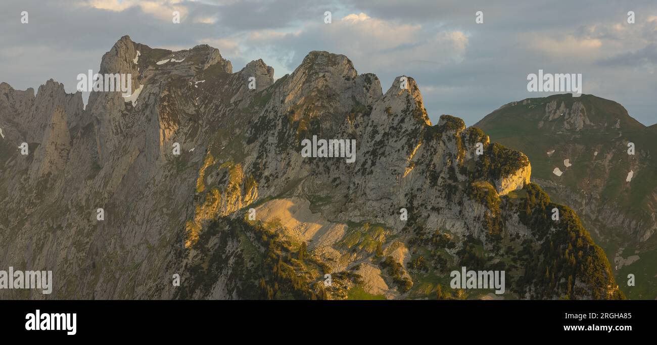 The Saxer Gap in the Swiss Alps is lit up by the sun on a morning Stock ...